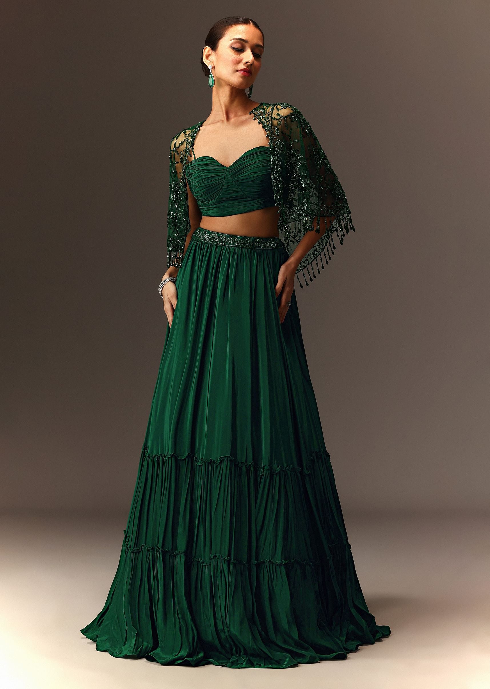 Bottle Green Tiered Lehenga With Net Cape | KALKI FASHION UK